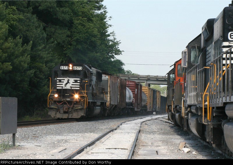 NS 6573 leads a fast train of empties on 5-21-06 through yard